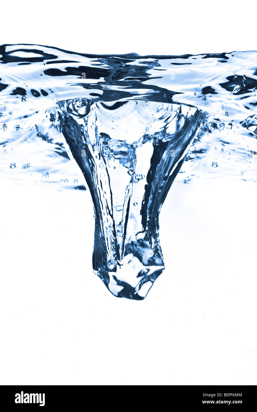 Ice cube dropped into water Stock Photo - Alamy