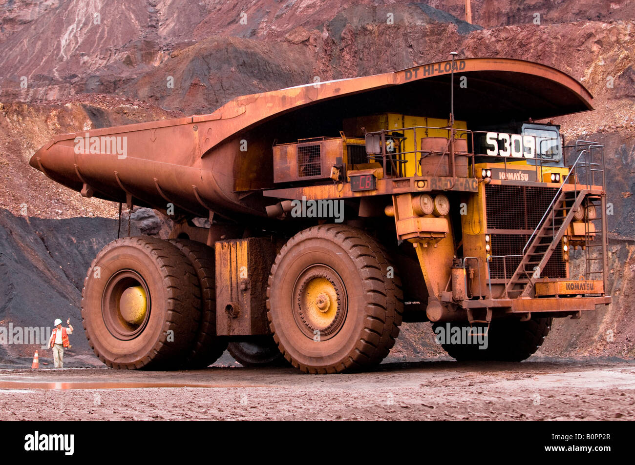 Employee helps to steer large off road truck at Vale s Carajas mine ...