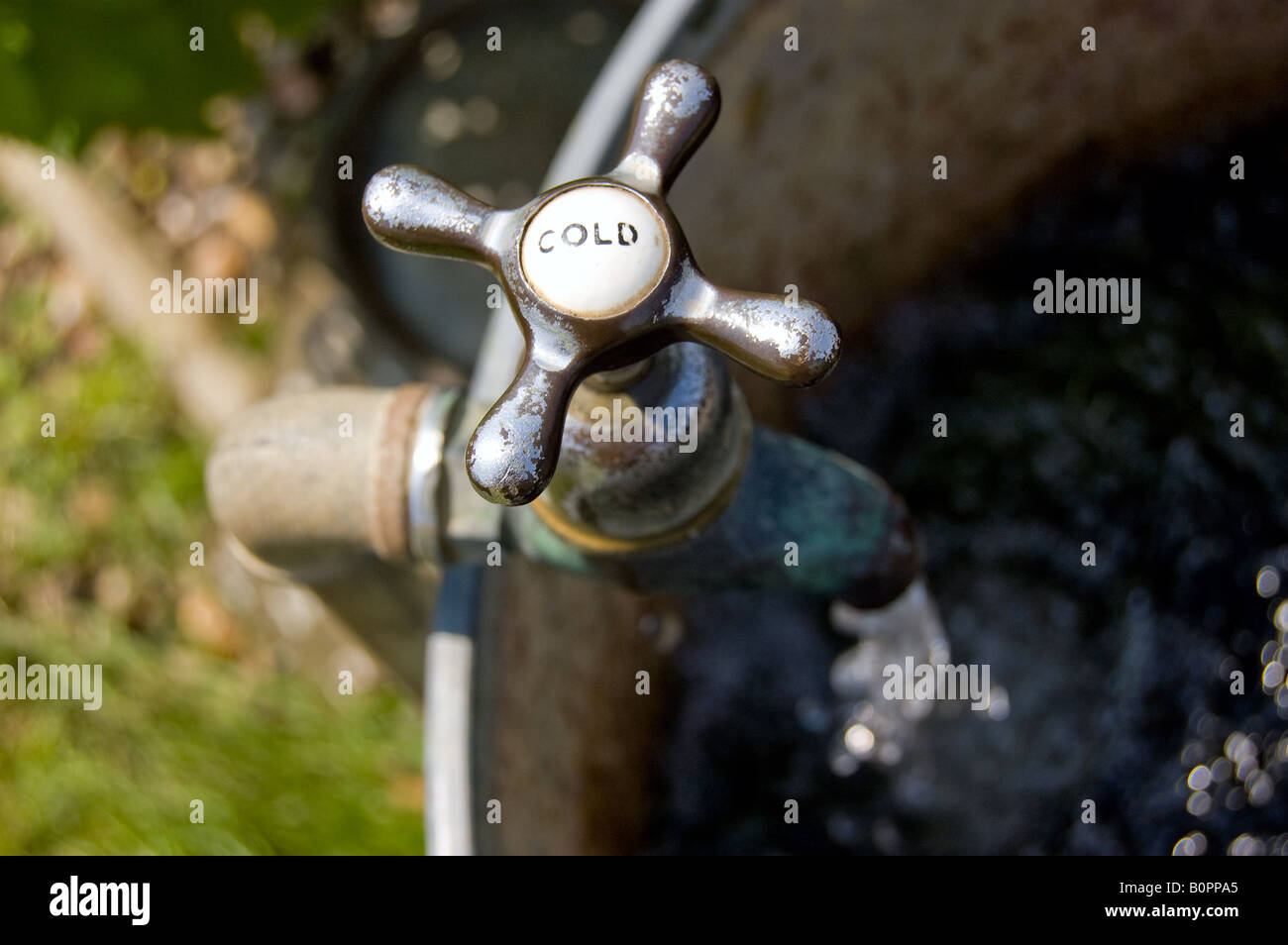 Looking down on a running tap Stock Photo - Alamy