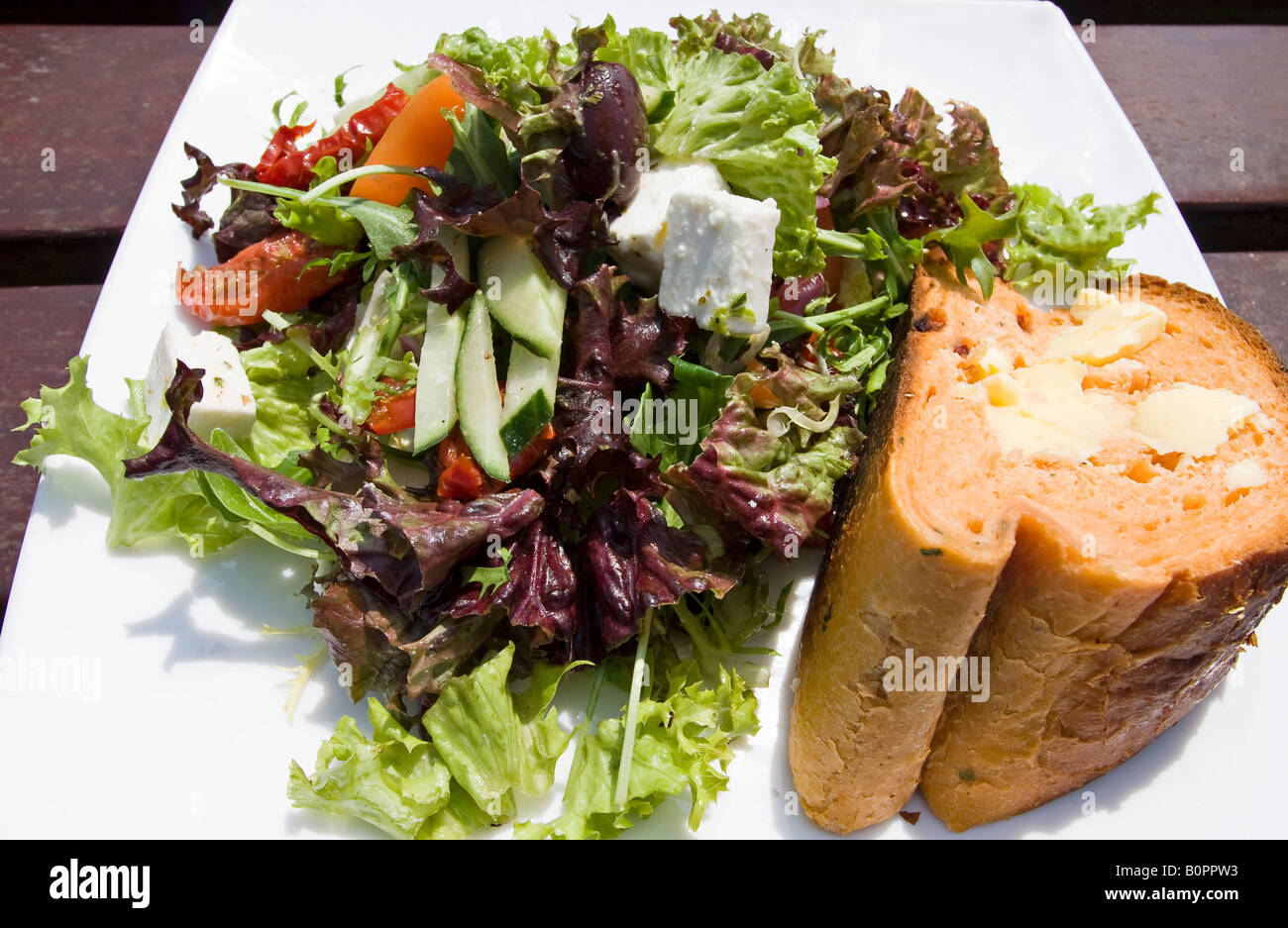 Rocket and feta salad with sun dried tomatoes Stock Photo - Alamy