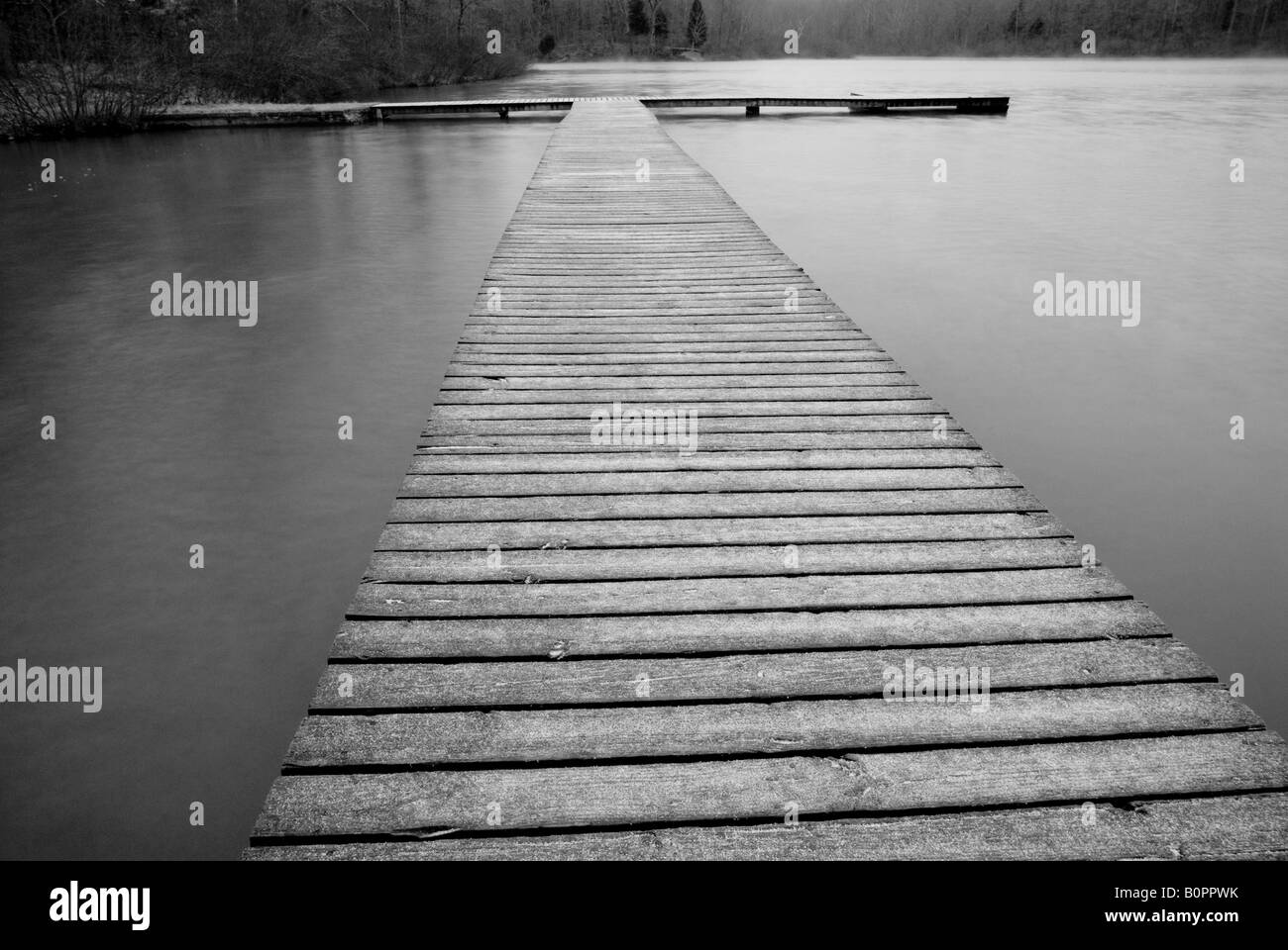 wooden boat dock on lake ice Stock Photo - Alamy