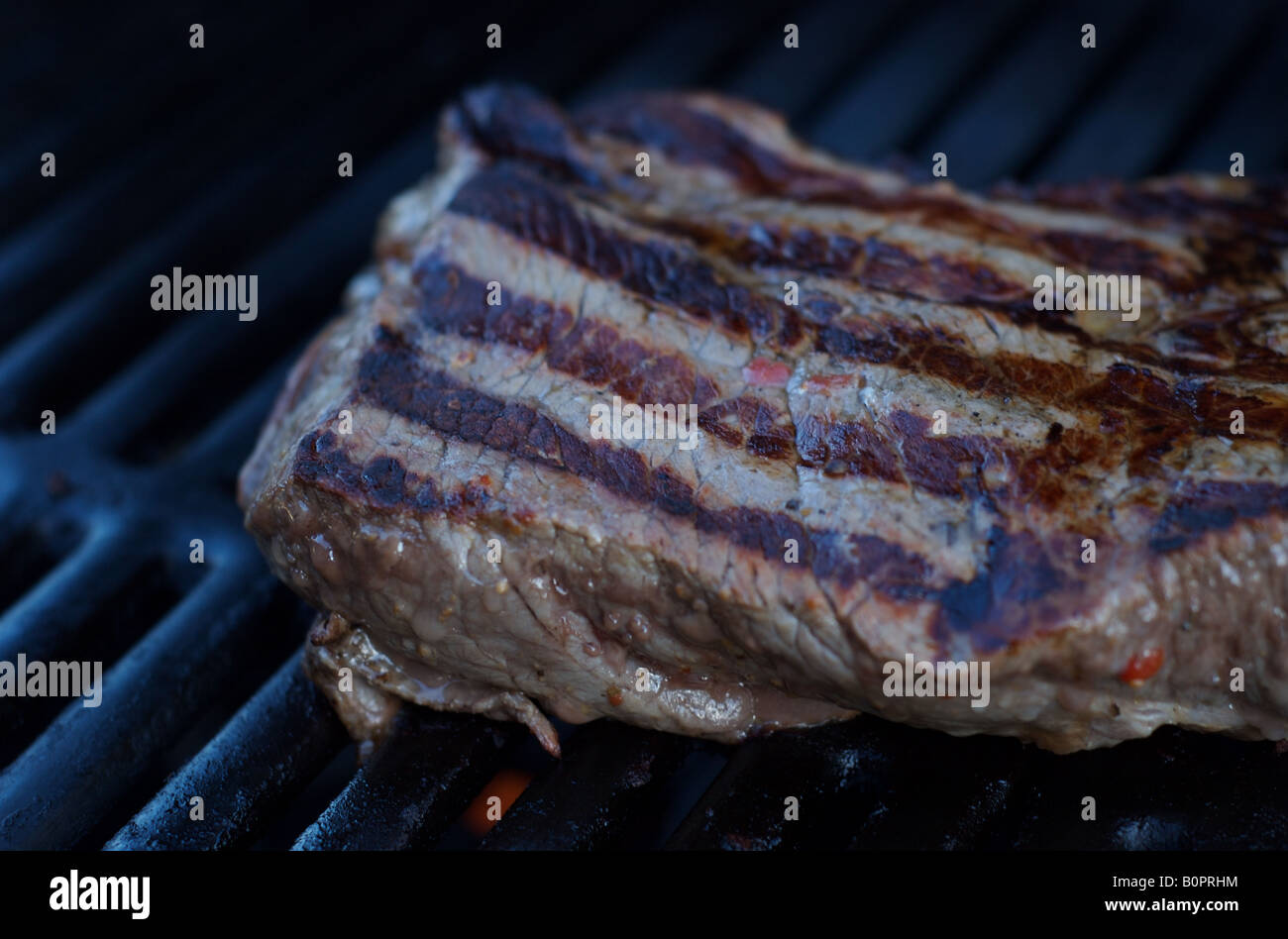 Steak on a grill top view Stock Photo - Alamy