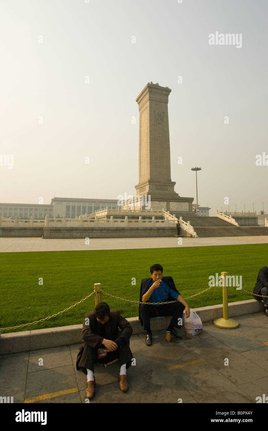 Monument obelisk two chinese men sitting public square hi-res stock ...