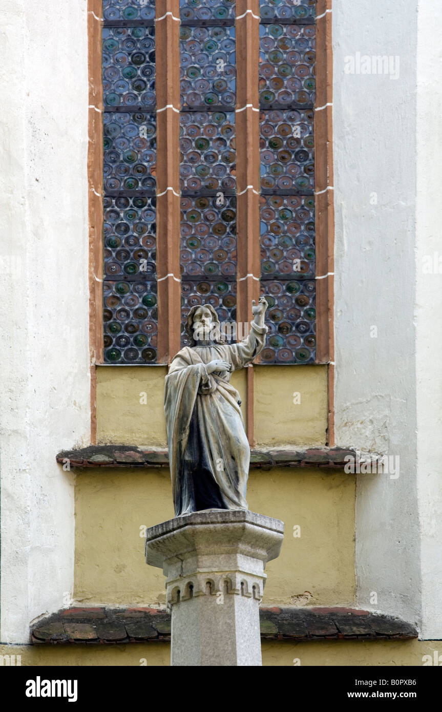 Statue and stained glass window Stock Photo - Alamy