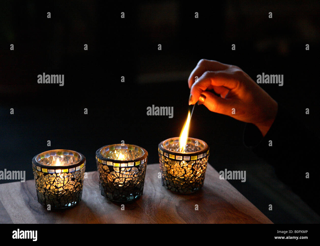 Three candles holder hi-res stock photography and images - Alamy