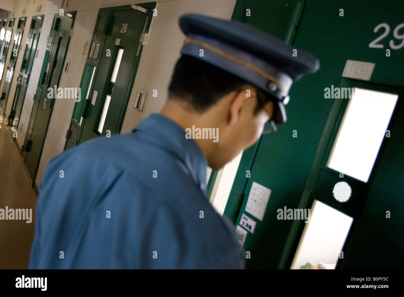 Prison guard checking cells, Onomichi prison, Japan Stock Photo - Alamy