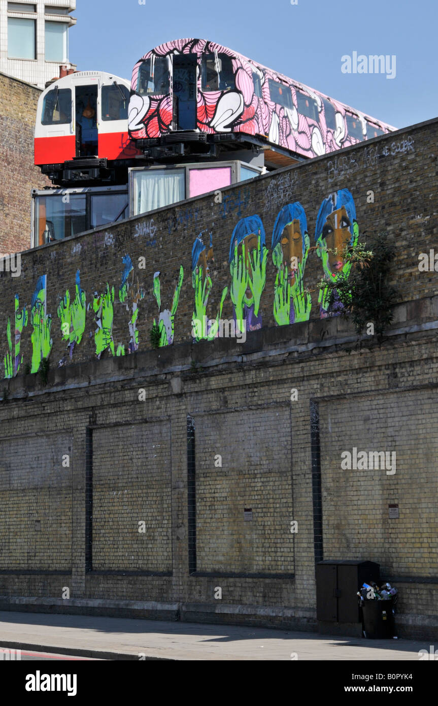 Recycled tube train carriages used as artists studios above old railway ...
