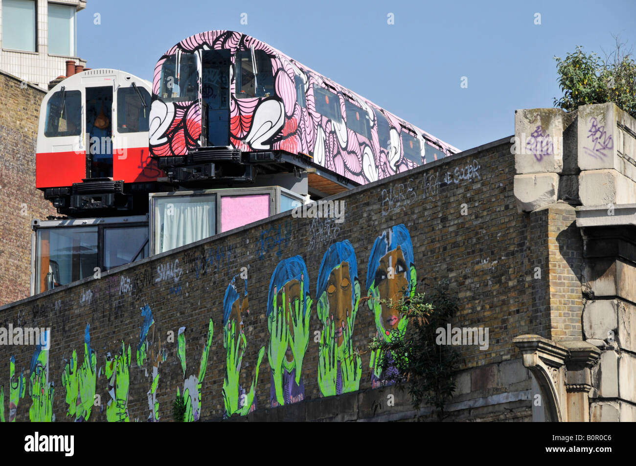 Recycled tube train carriages used as artists studios above old railway ...