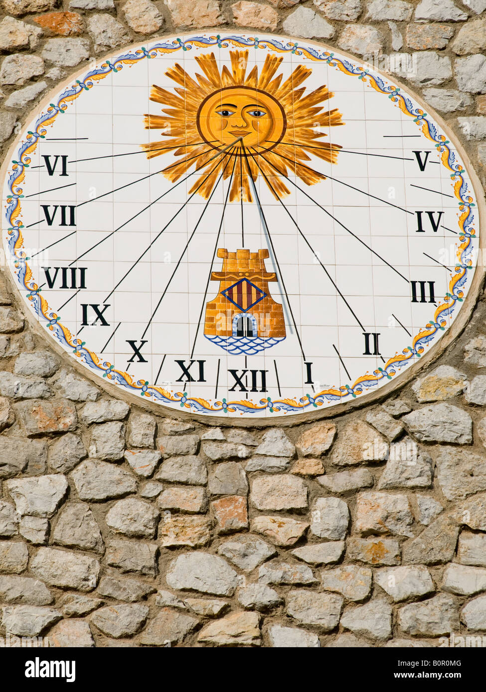 Ceramic sundial on the stone wall Stock Photo - Alamy