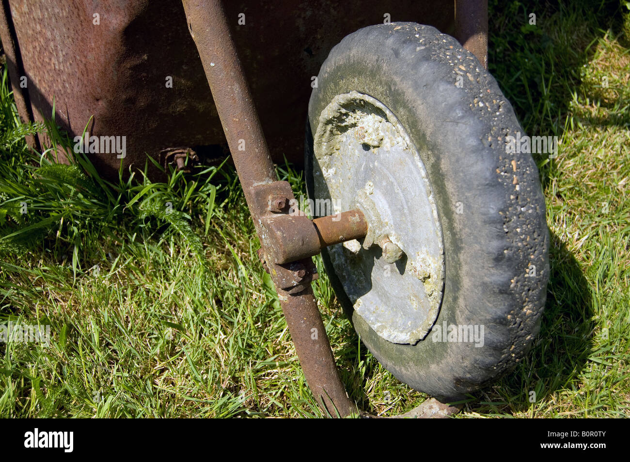 The wheel of an old rusty wheelbarrow Stock Photo - Alamy