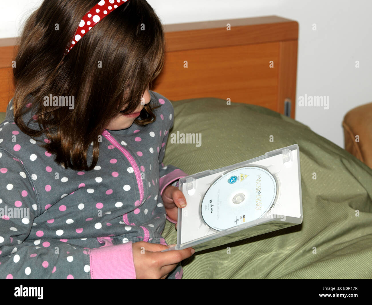 Ten year old Girl Opening a DVD Stock Photo - Alamy