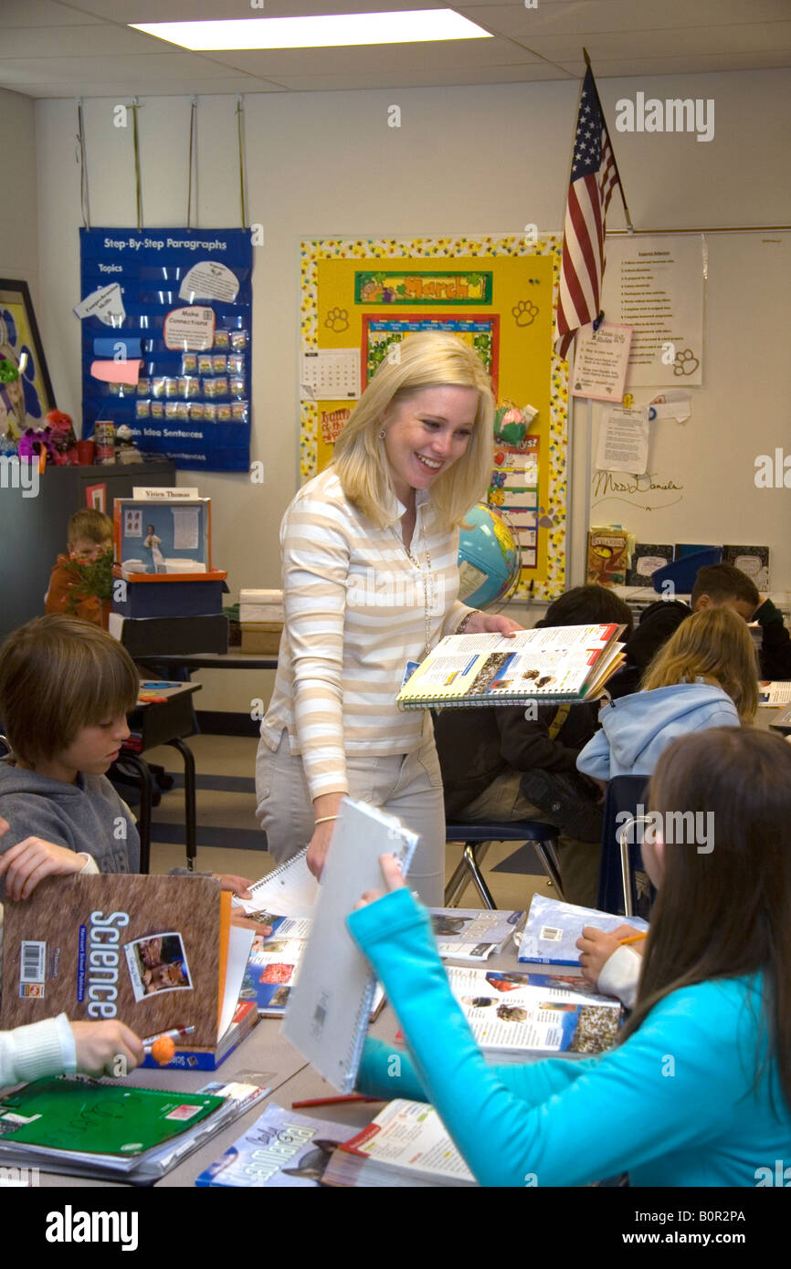 Female fourth grade teacher with students in a classroom in Tampa ...