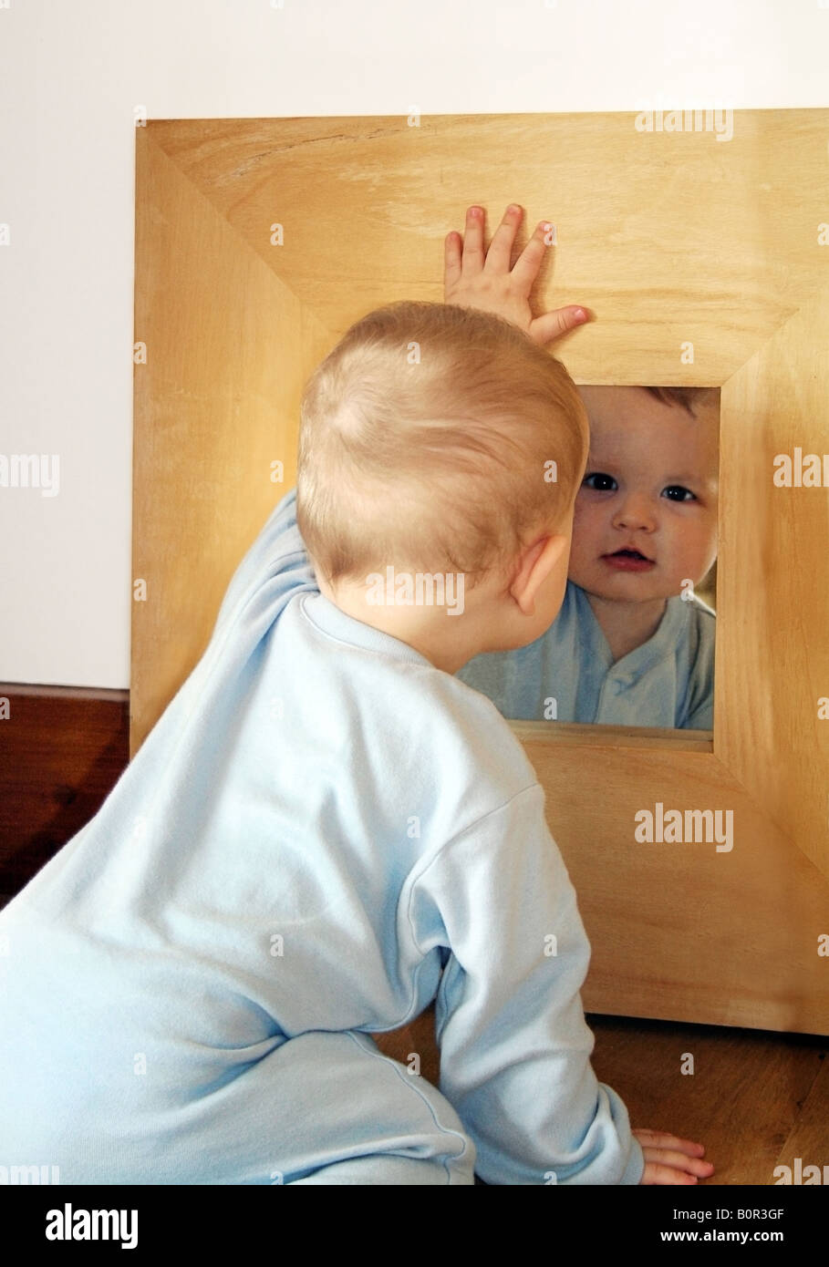 Infant looking in mirror hi-res stock photography and images - Alamy