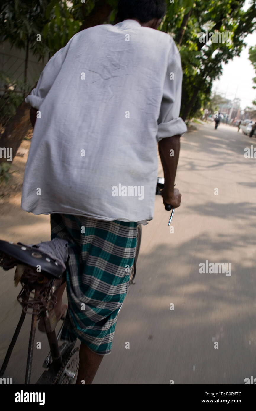 Rickshaw puller pedaling rickshaw in Bangladesh Stock Photo - Alamy