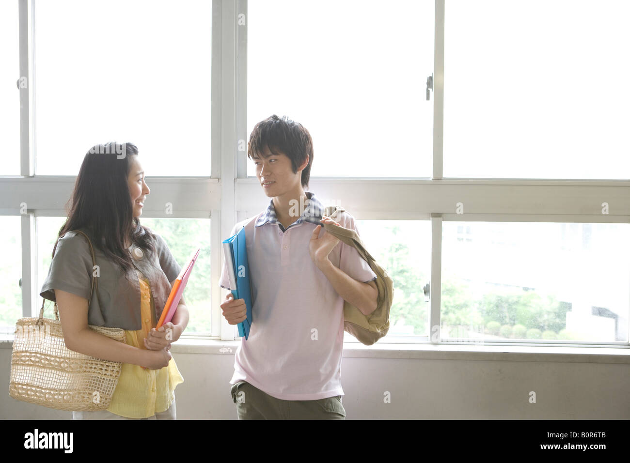 Two students talking Stock Photo - Alamy