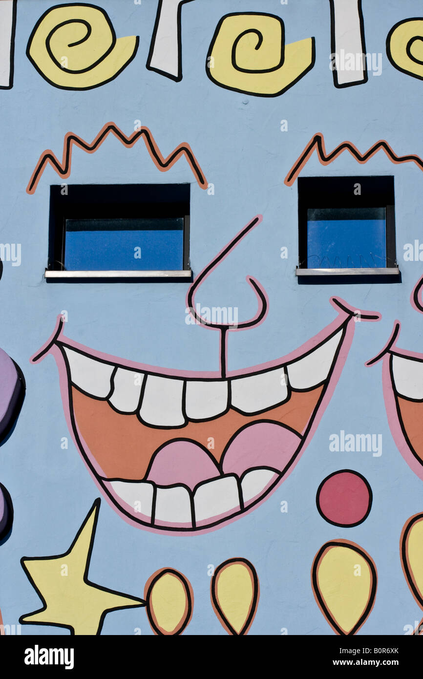 A laughing happy face on the exterior facade of the Happy Rizzi House ...