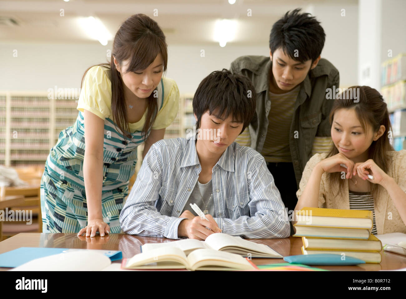 Students studying in library Stock Photo - Alamy