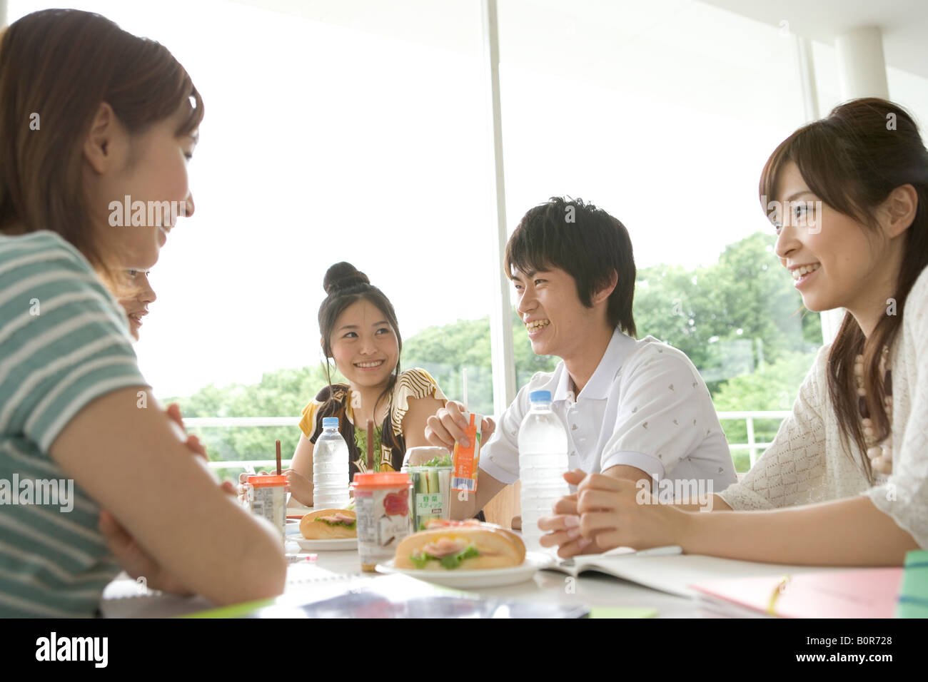 Students eating lunch in cafeteria Stock Photo - Alamy