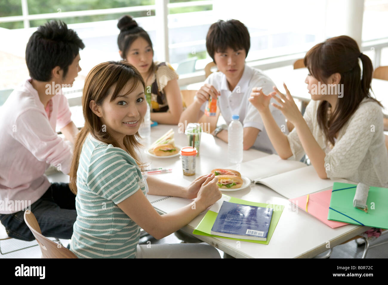 Students eating lunch in cafeteria Stock Photo - Alamy