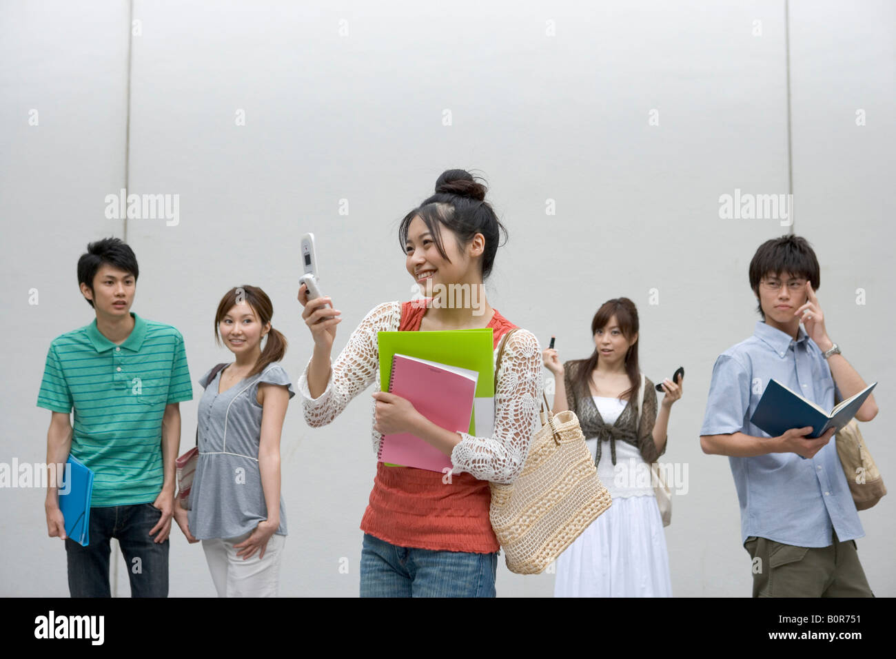 Group of students using mobile phones Stock Photo - Alamy