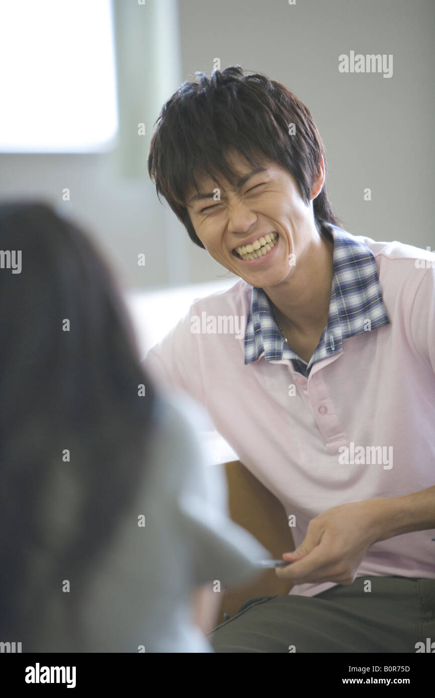 Two students laughing Stock Photo - Alamy