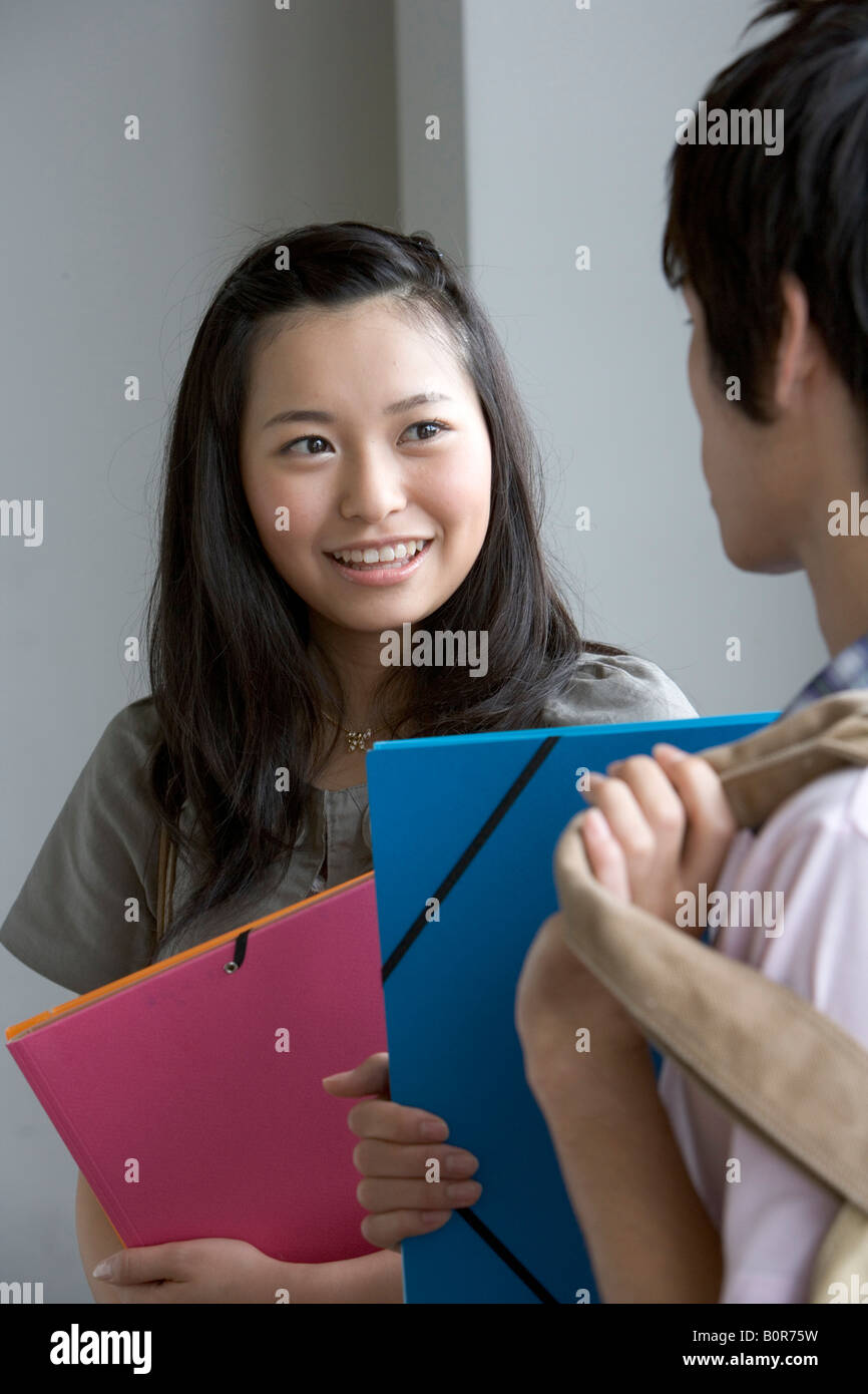 Two students talking Stock Photo - Alamy