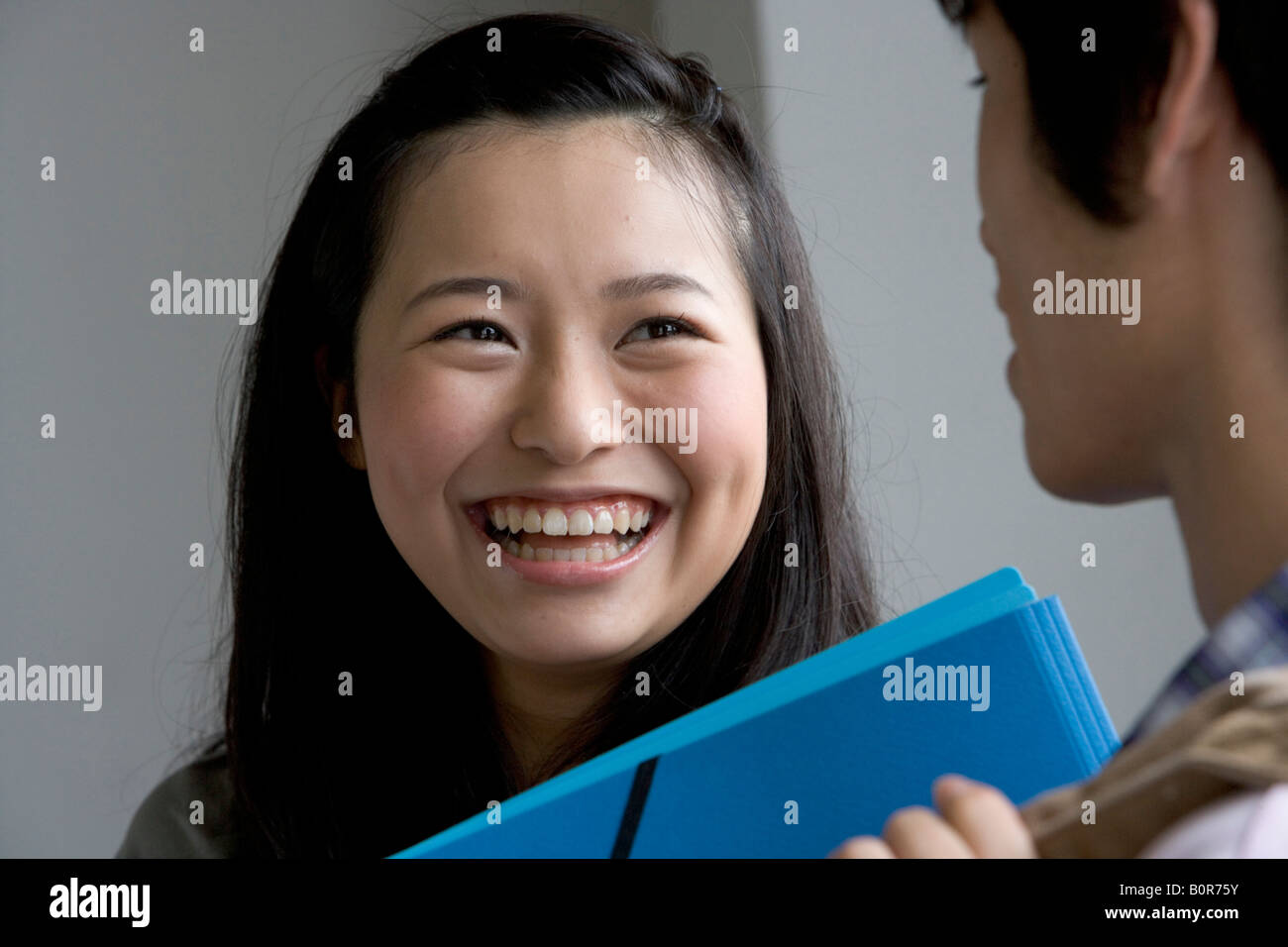 Two students laughing Stock Photo - Alamy
