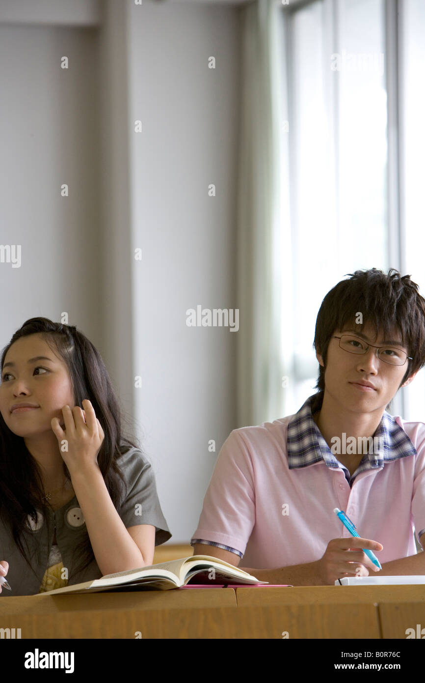 Two students in classroom Stock Photo - Alamy