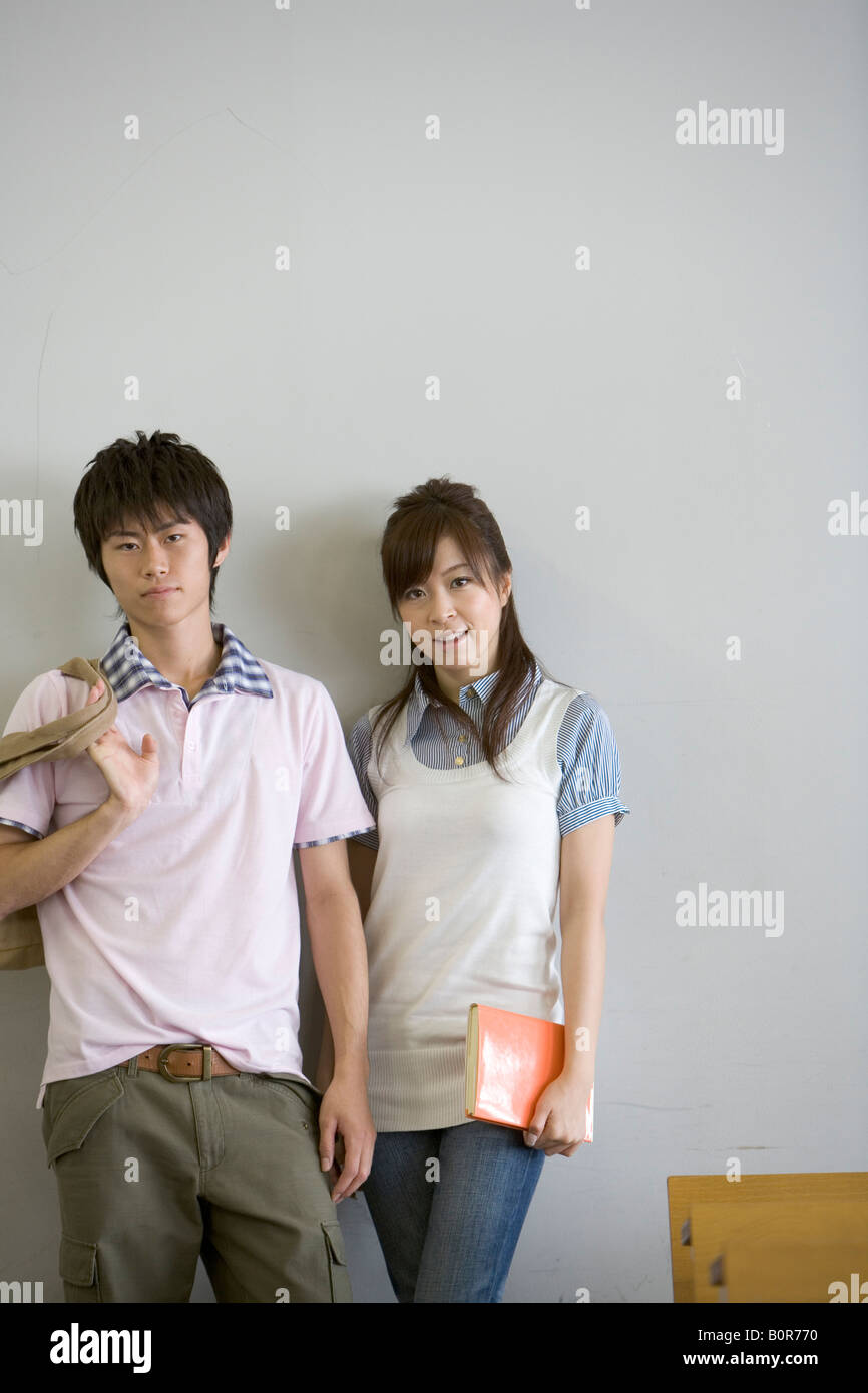 Young man and woman in classroom Stock Photo - Alamy