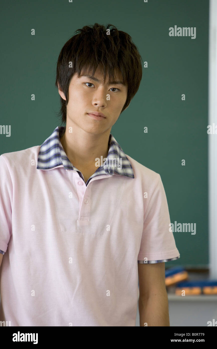 Male student in classroom Stock Photo - Alamy
