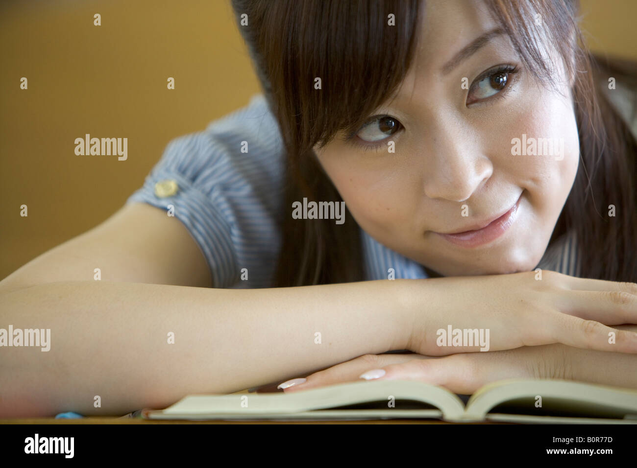 Young woman with book Stock Photo - Alamy