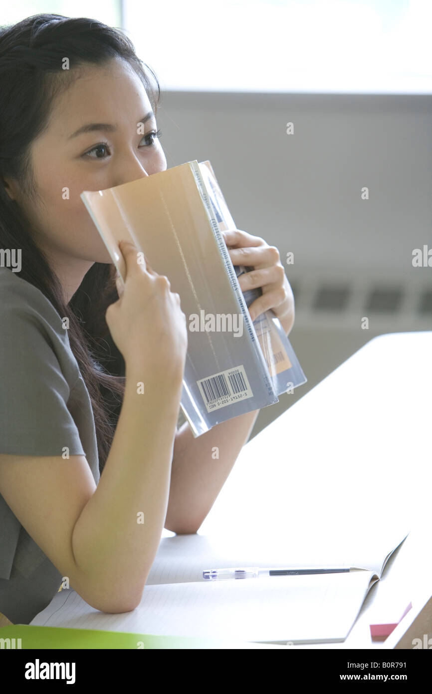 Female student with book Stock Photo - Alamy