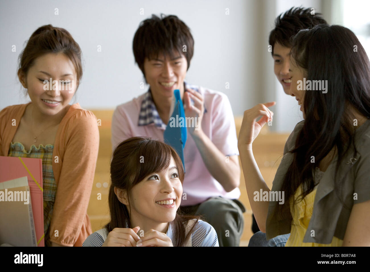 Students laughing in classroom Stock Photo - Alamy