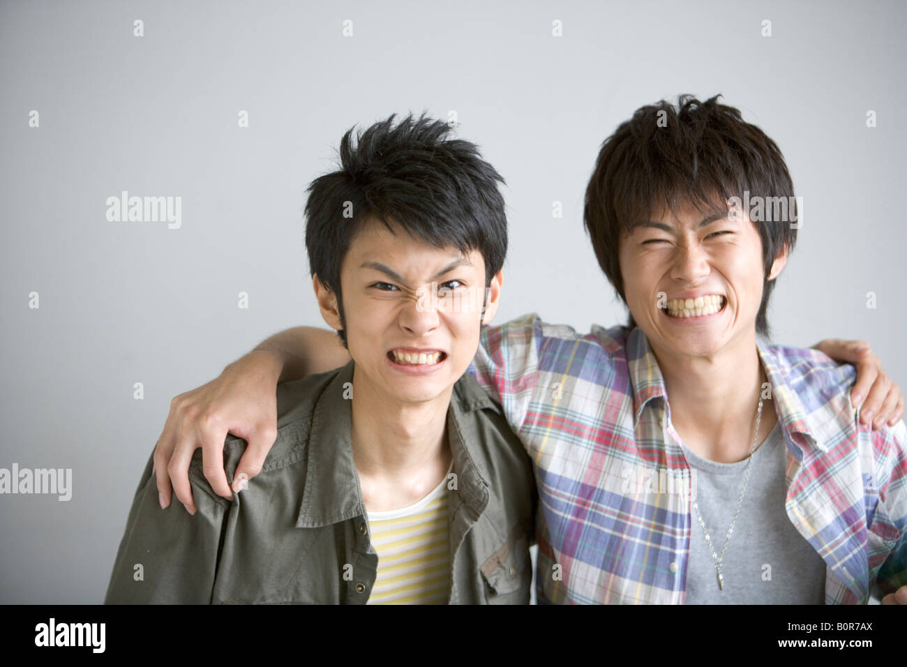 Two young men making faces Stock Photo - Alamy