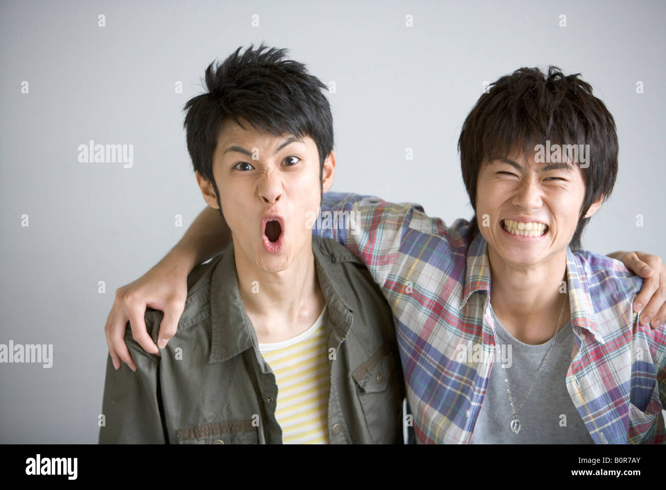 Two young men making faces Stock Photo - Alamy