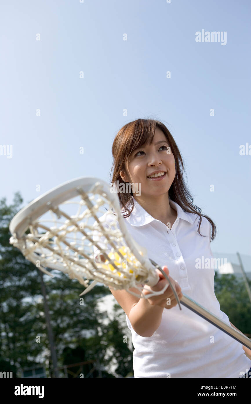 Teenage girl playing lacrosse Stock Photo - Alamy
