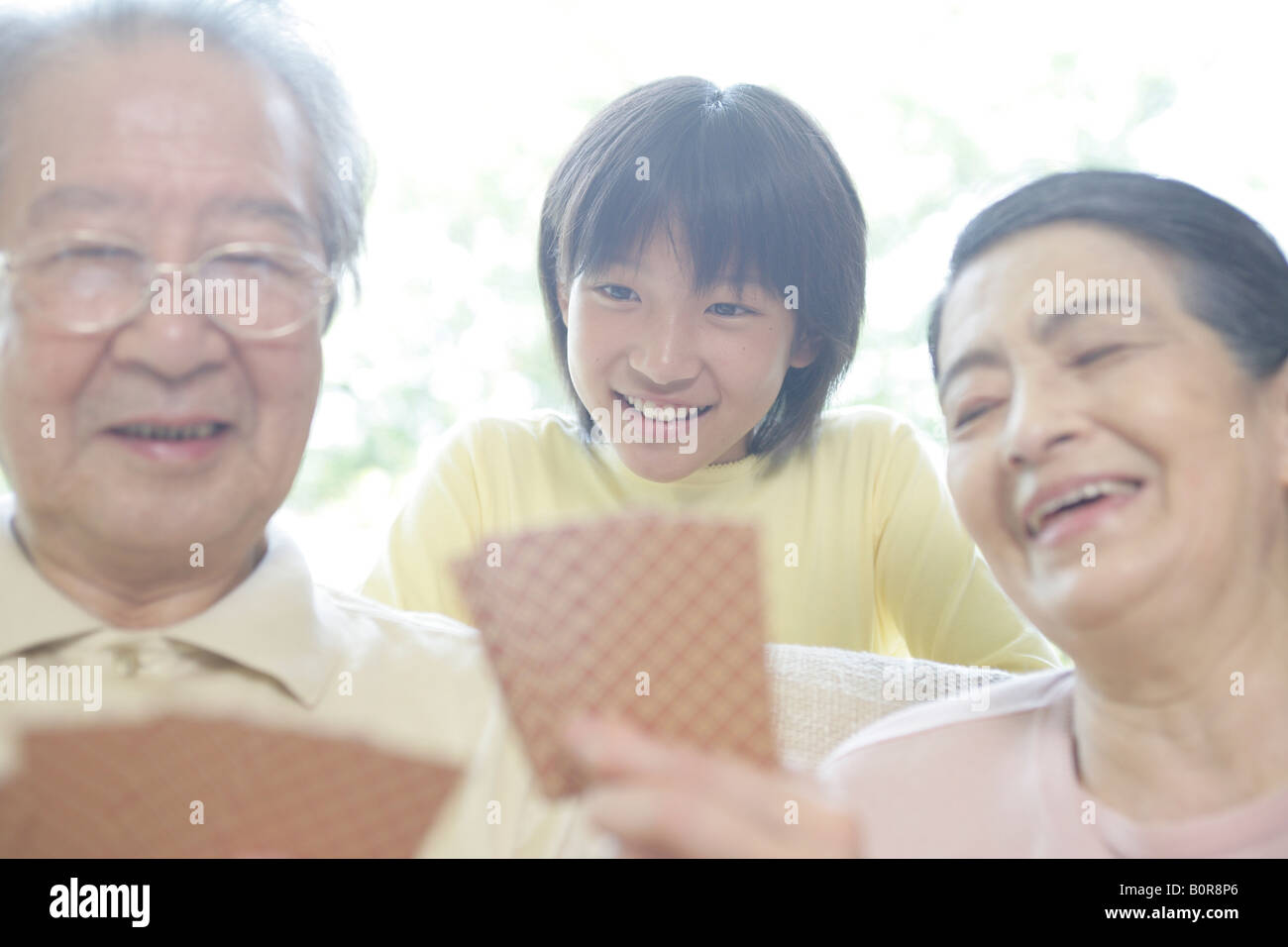Asian family playing cards hi-res stock photography and images - Alamy