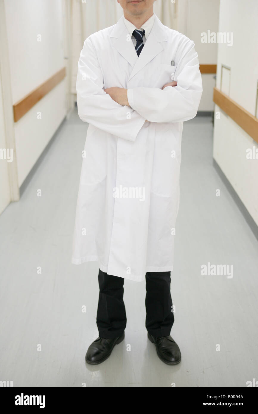Male doctor in hospital corridor, low section Stock Photo - Alamy