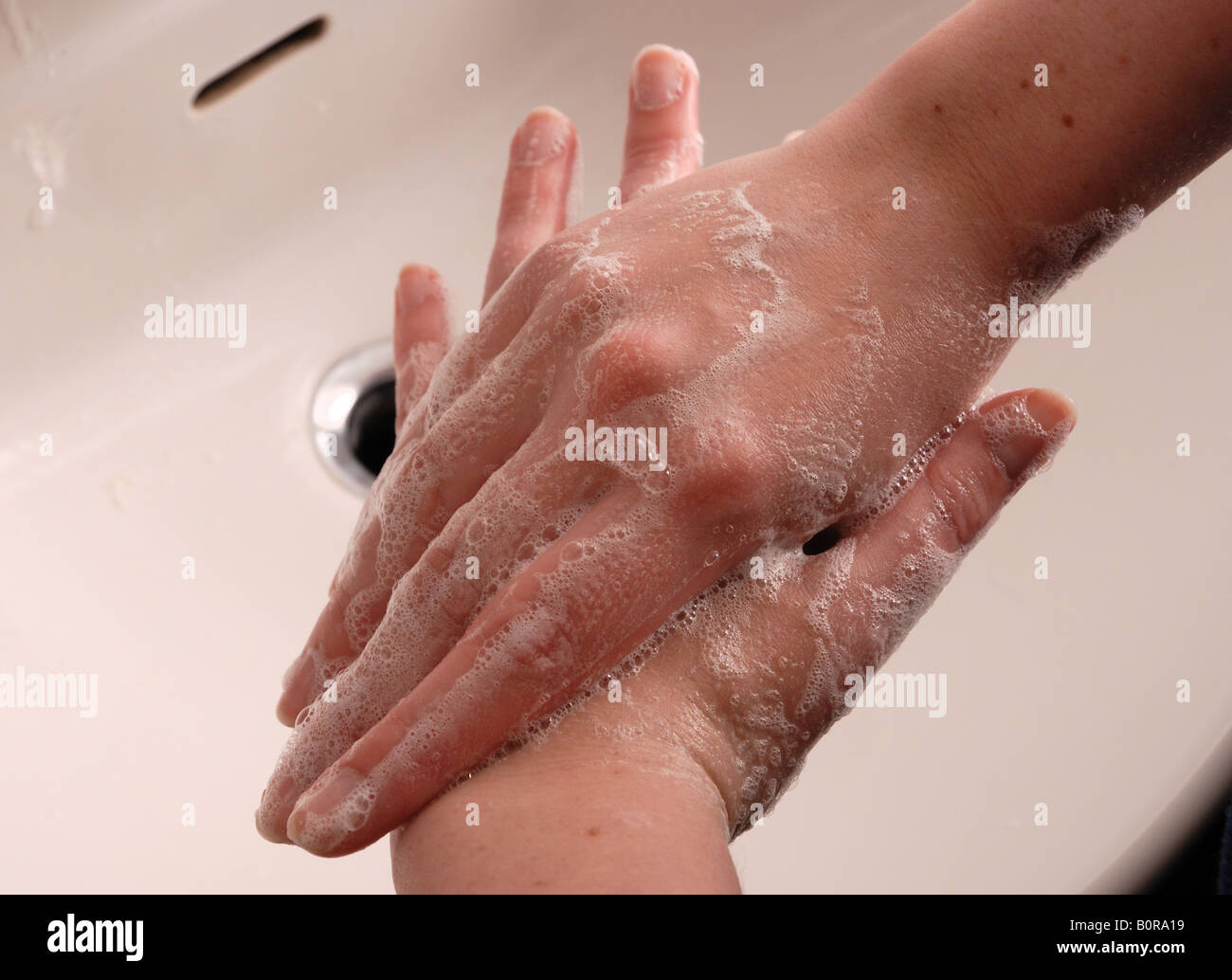 Handwashing - cleaning the back of the hand and thumb joint Stock Photo ...