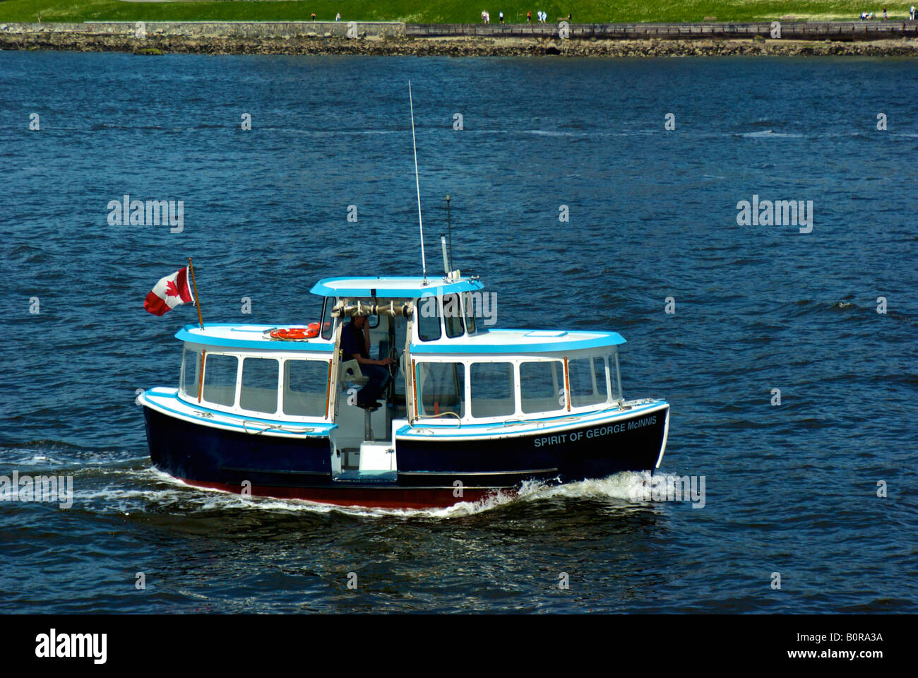 Small commuter passenger ferry water taxi boat plying the the waters at ...