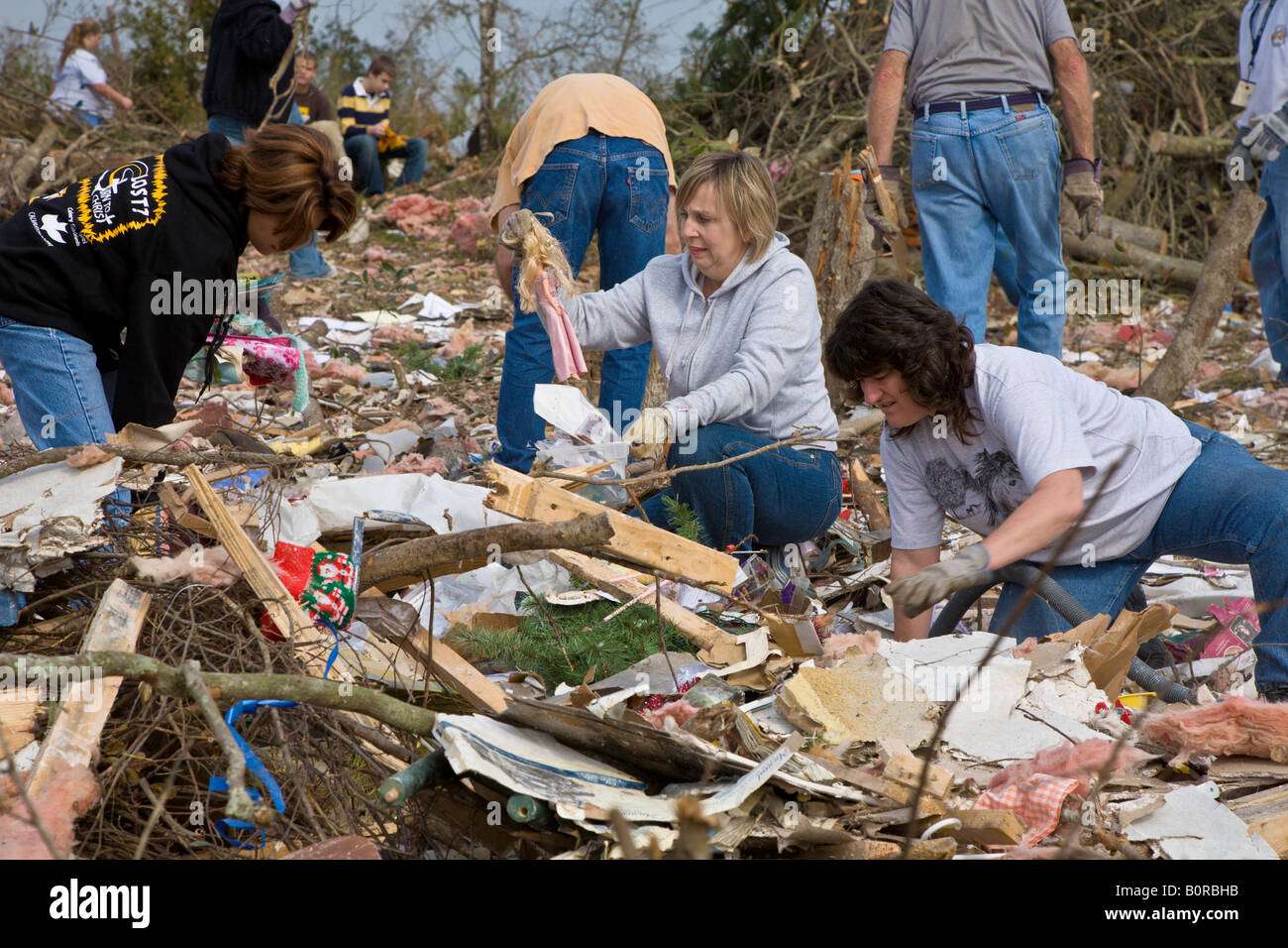 Disaster relief workers pick through destruction to find personal ...