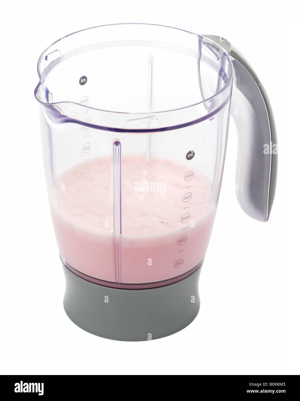 Smoothie in blender made with strawberries isolated on white background ...