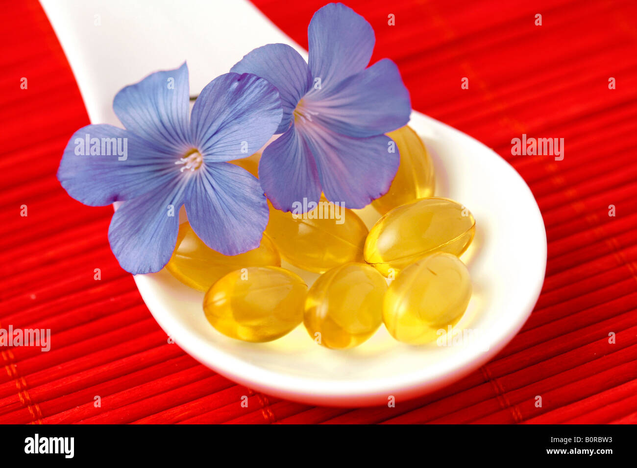 Linseed oil capsules Stock Photo - Alamy