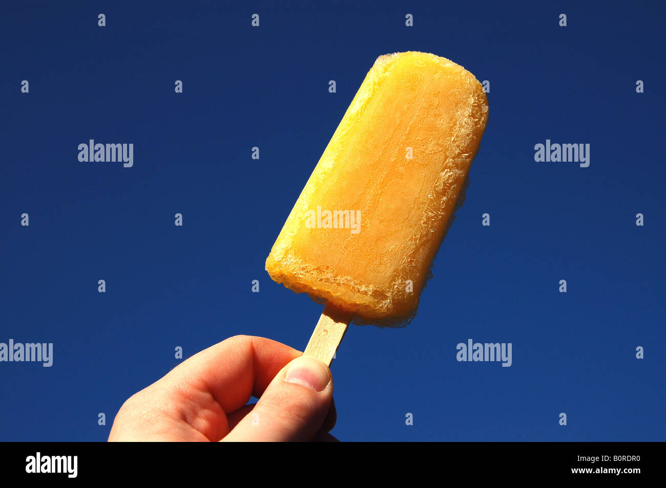Ice lolly against a vivid blue sky Stock Photo - Alamy