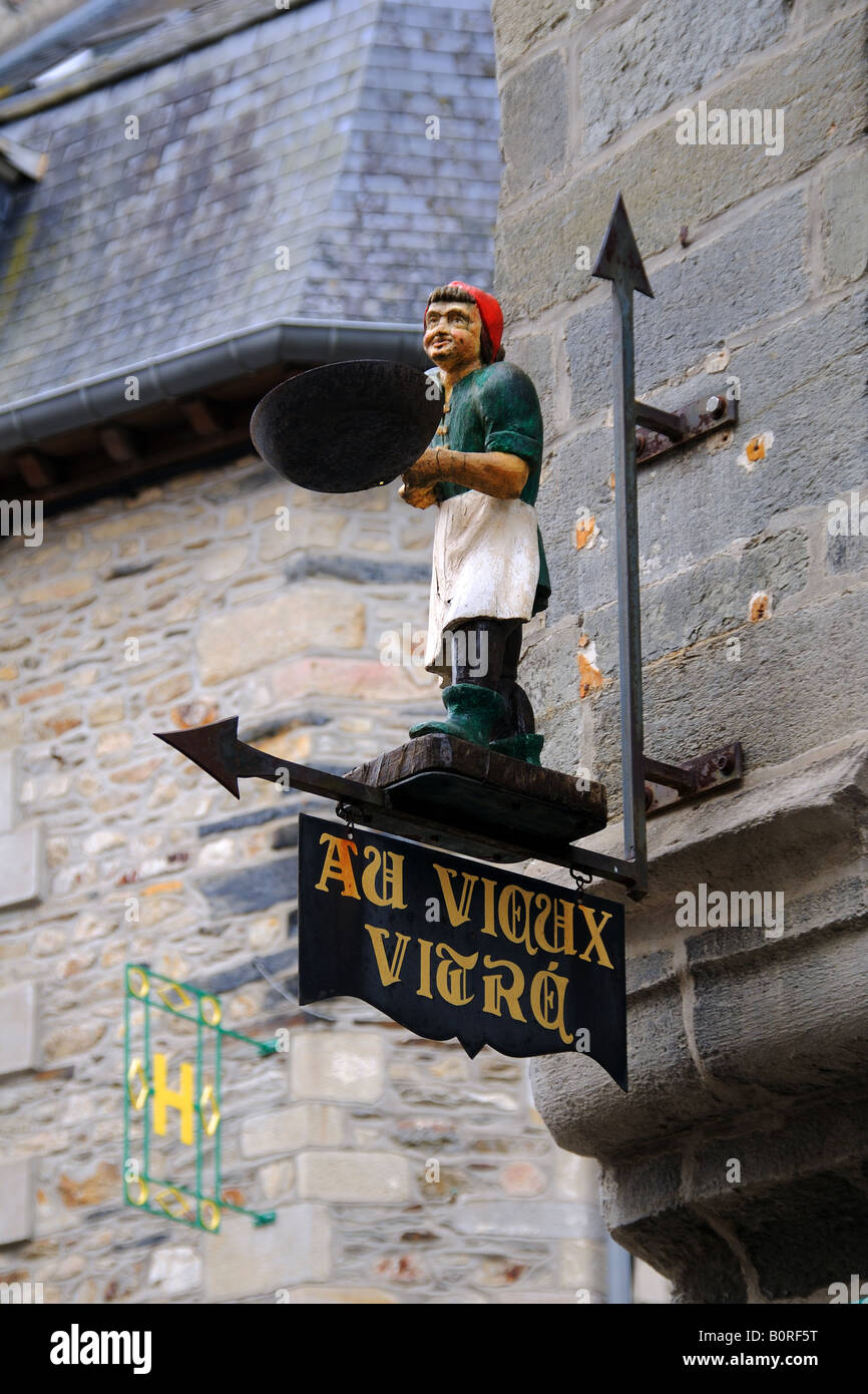 A traders sign above a shop in the medieval heart of Vitre a town in ...