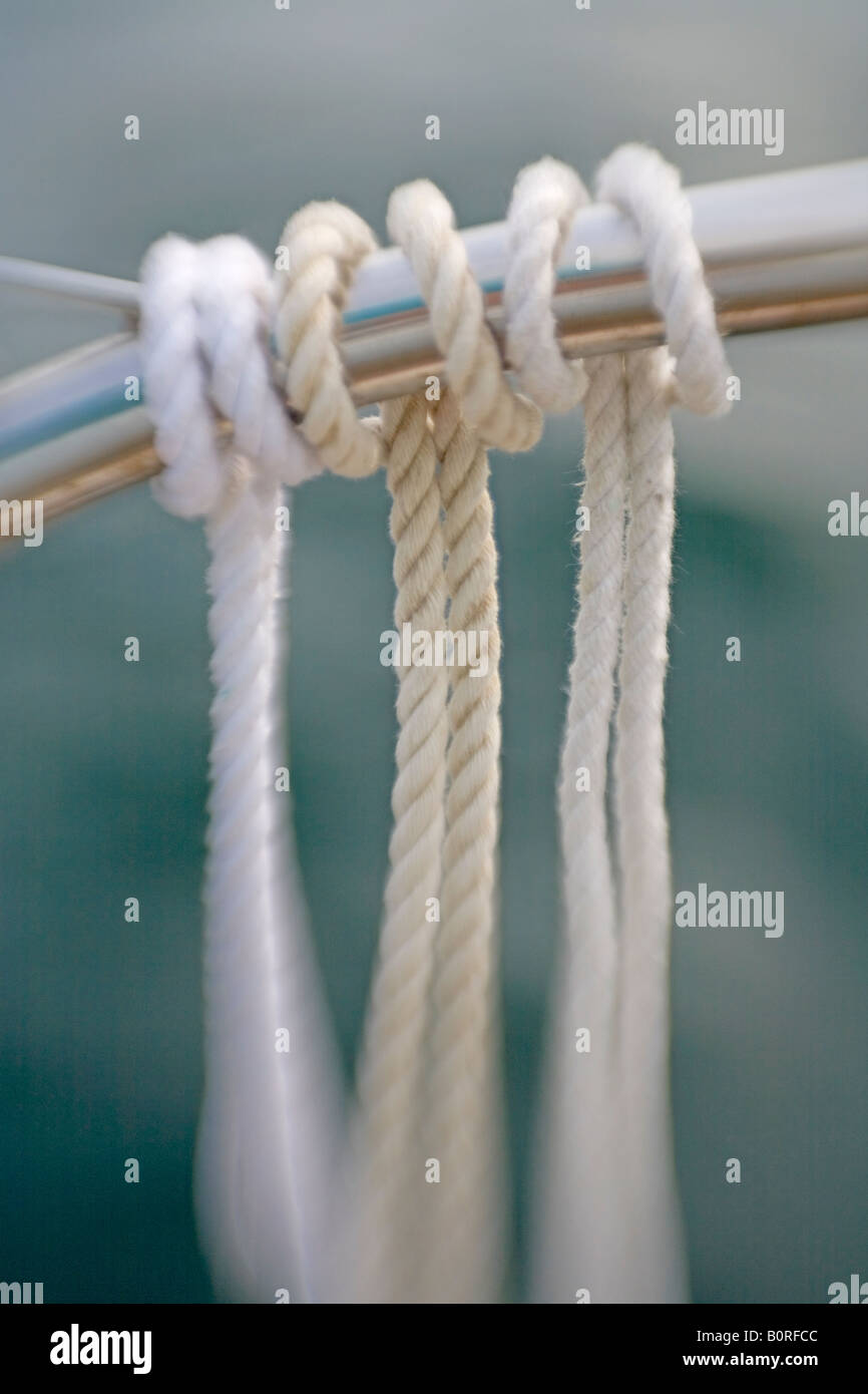 rope tied to railing on sail boat simple summer pattern Stock Photo - Alamy