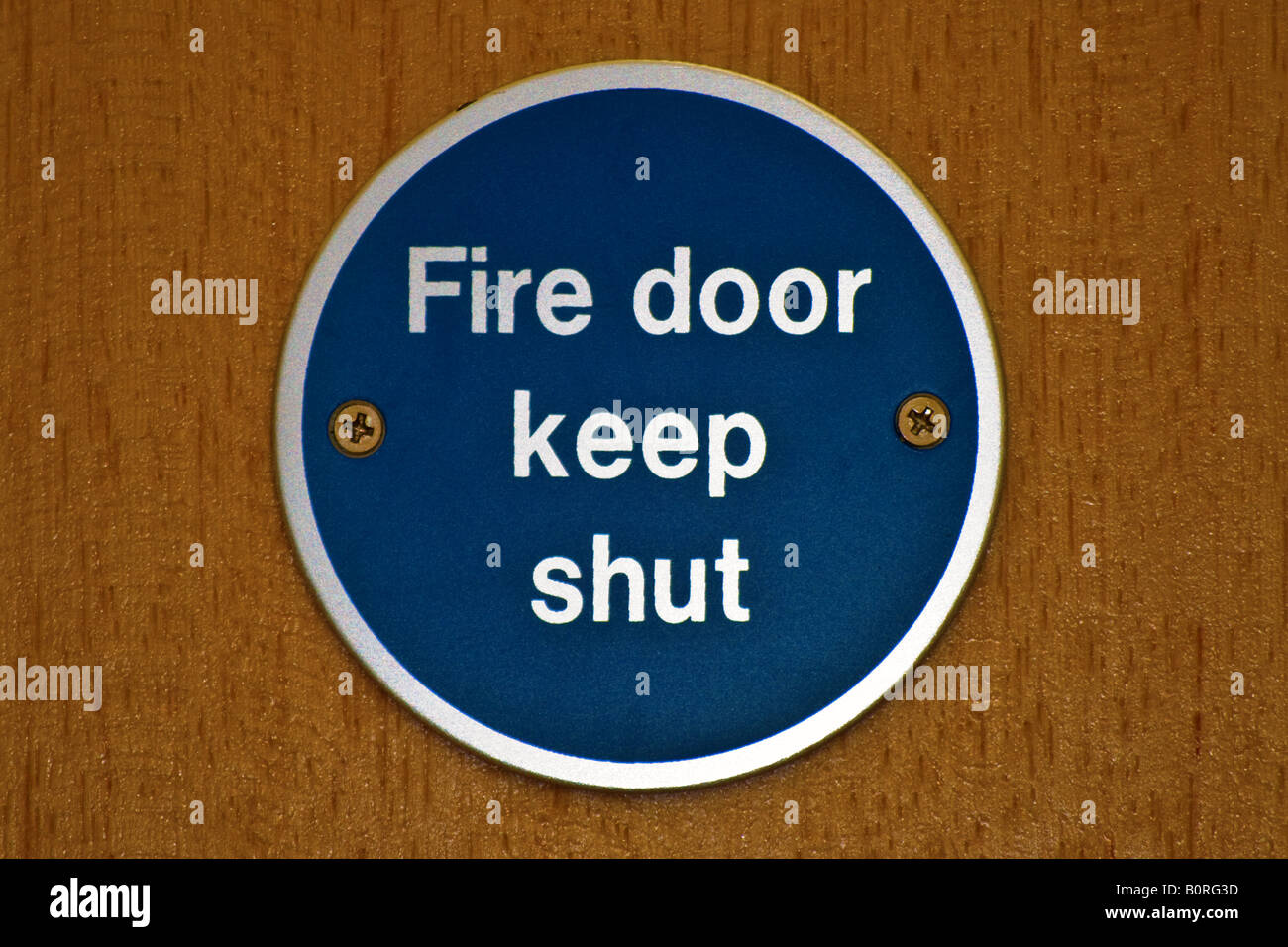 Blue fire door keep shut sign Stock Photo - Alamy