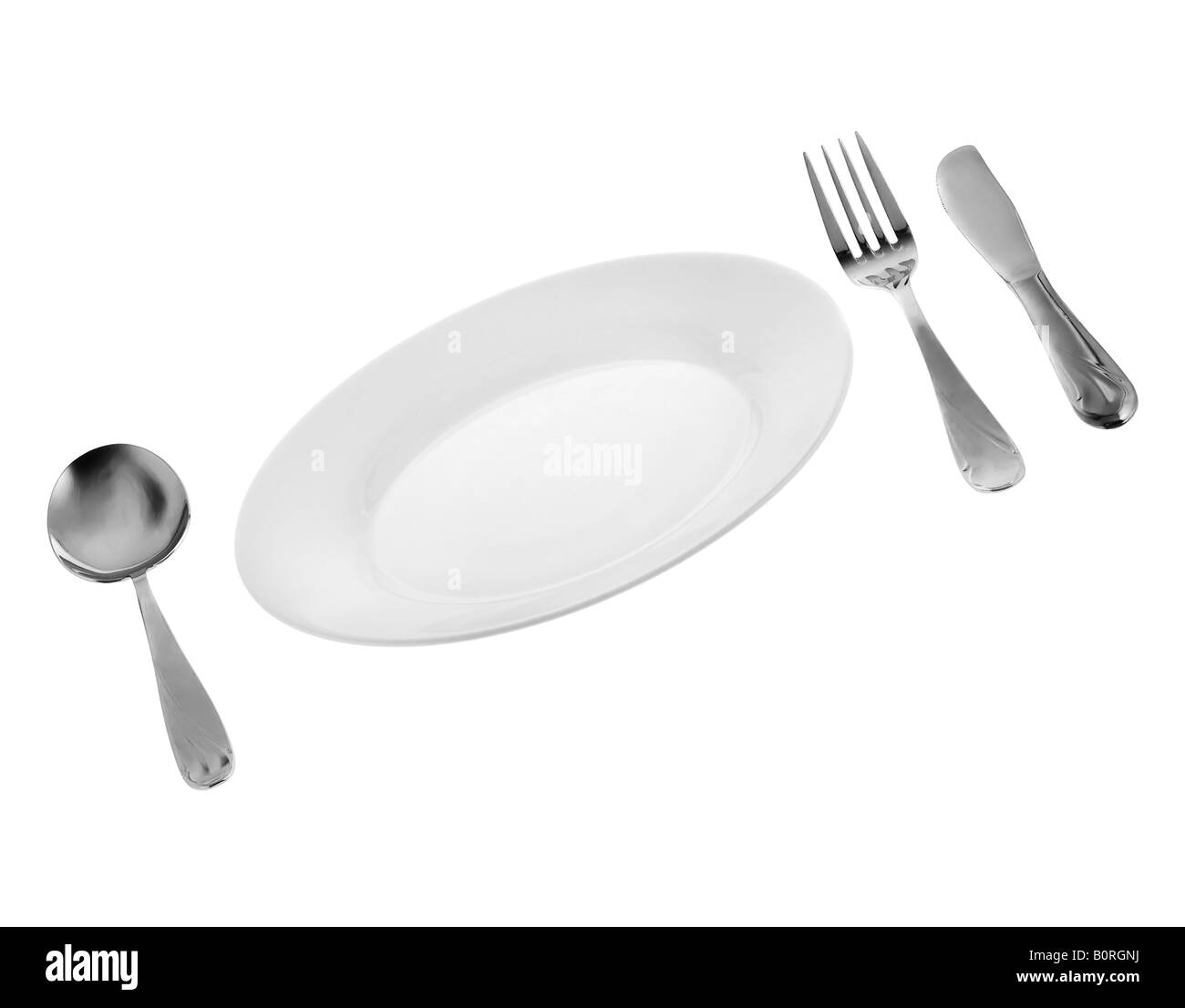 Set of kitchen object The spoon a plug a knife a plate Separately on a ...