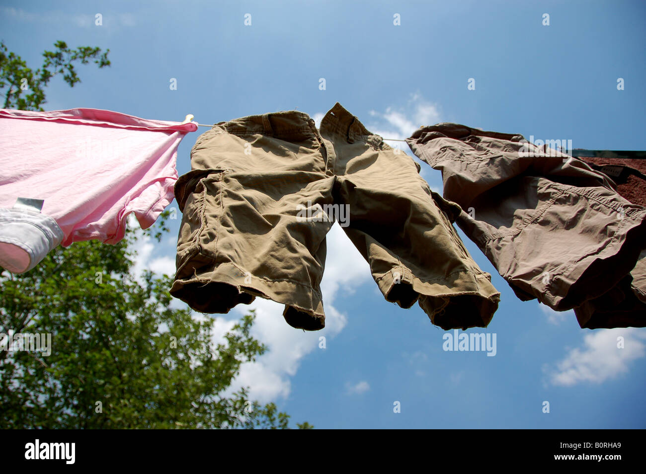 Washing drying on a line in a garden Stock Photo - Alamy