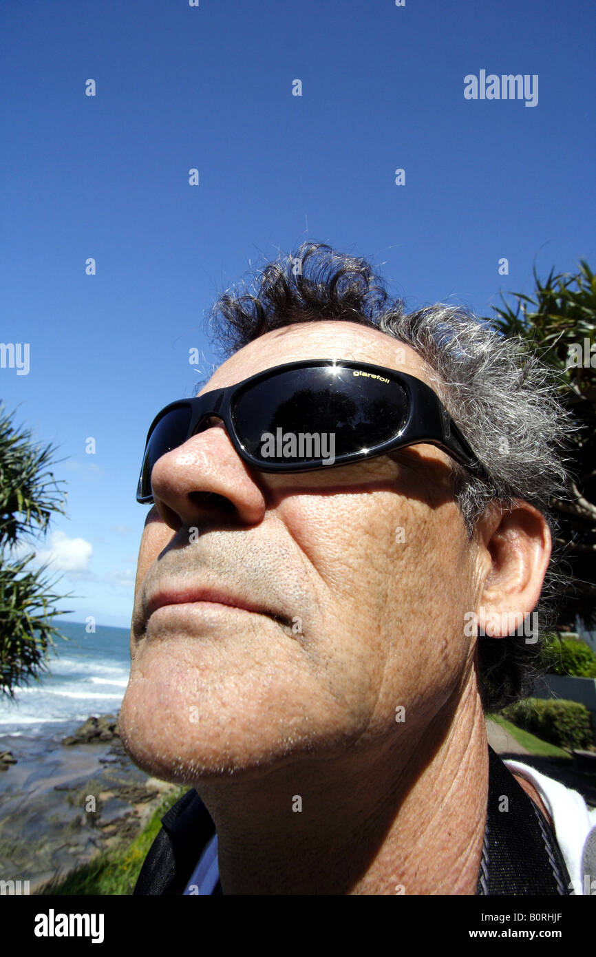 A FIFTY YEAR OLD MAN SIDE VIEW WITH A PROTRUDING JAW LINE AND DISTORTED ...